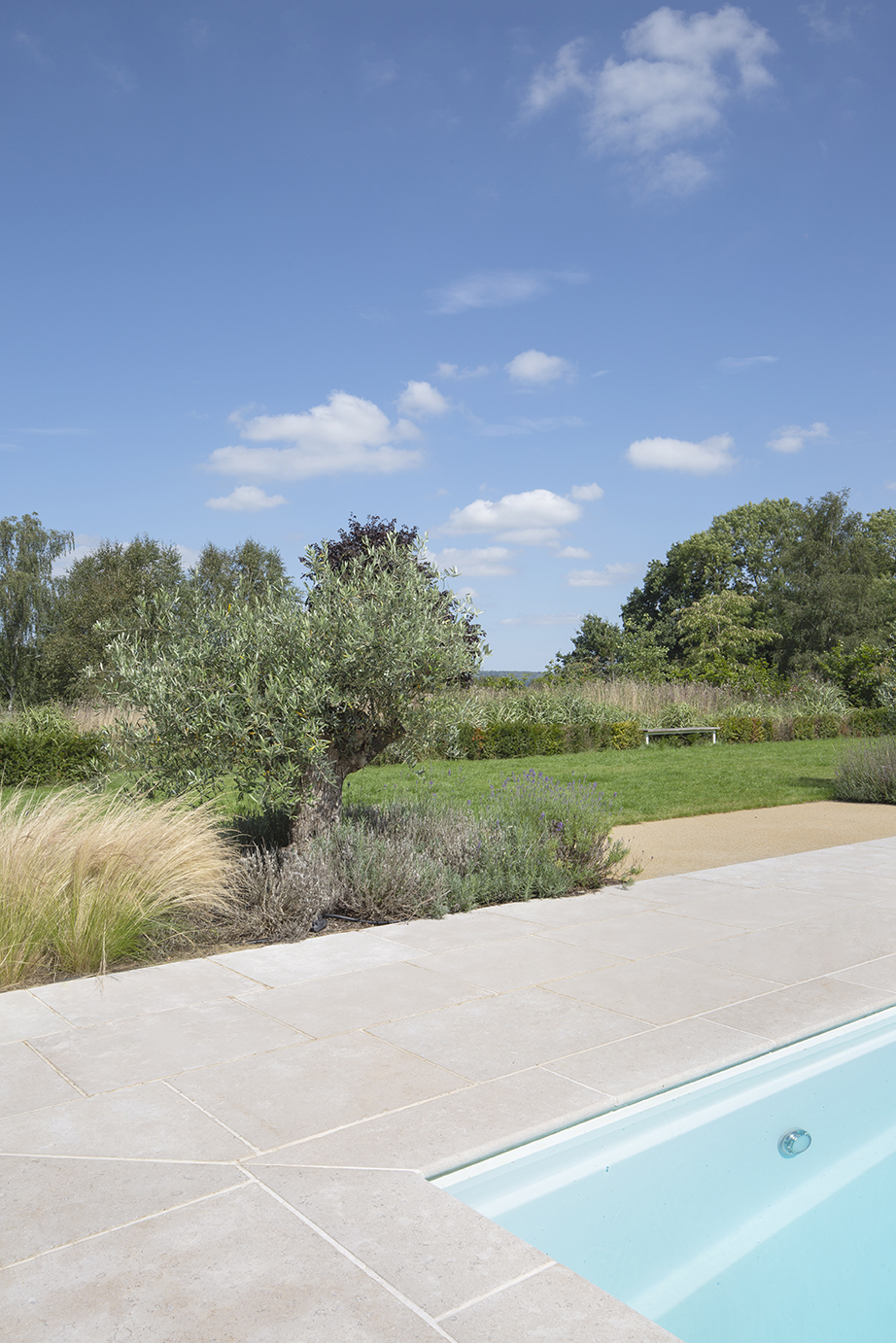 Using Dijon Limestone Paving To Create A Pool Garden